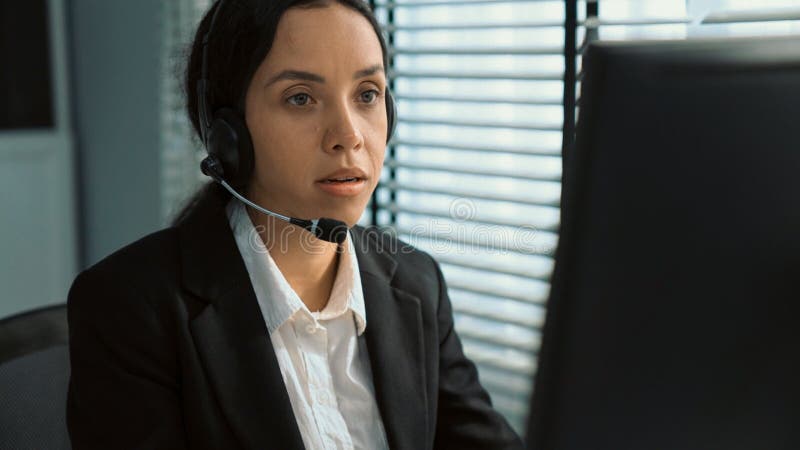 Competent Female Operator Working on Computer and while Talking with ...