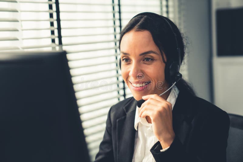 Competent Female Operator Working on Computer and while Talking with ...