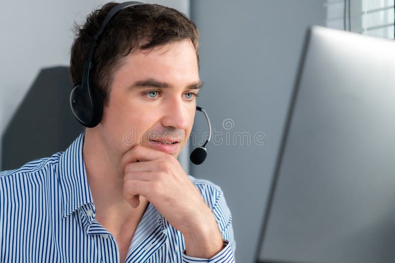 Competent Male Operator Working with Customers in the Office. Stock ...