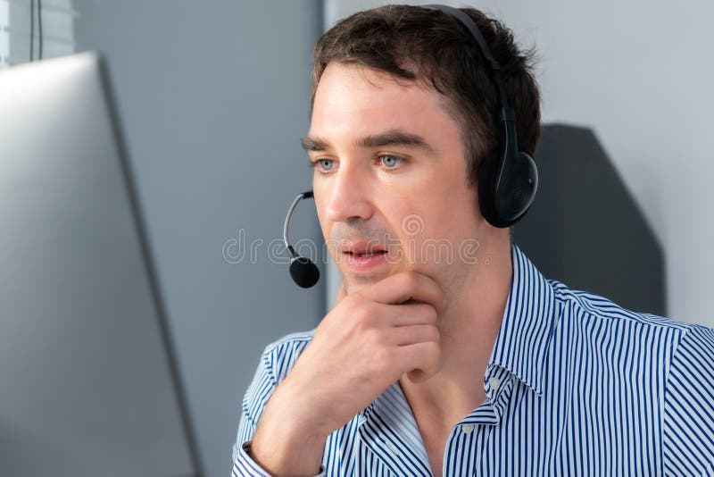 Competent Male Operator Working with Customers in the Office. Stock ...