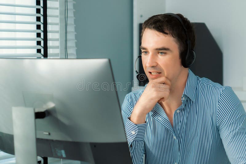 Competent Male Operator Working with Customers in the Office. Stock ...