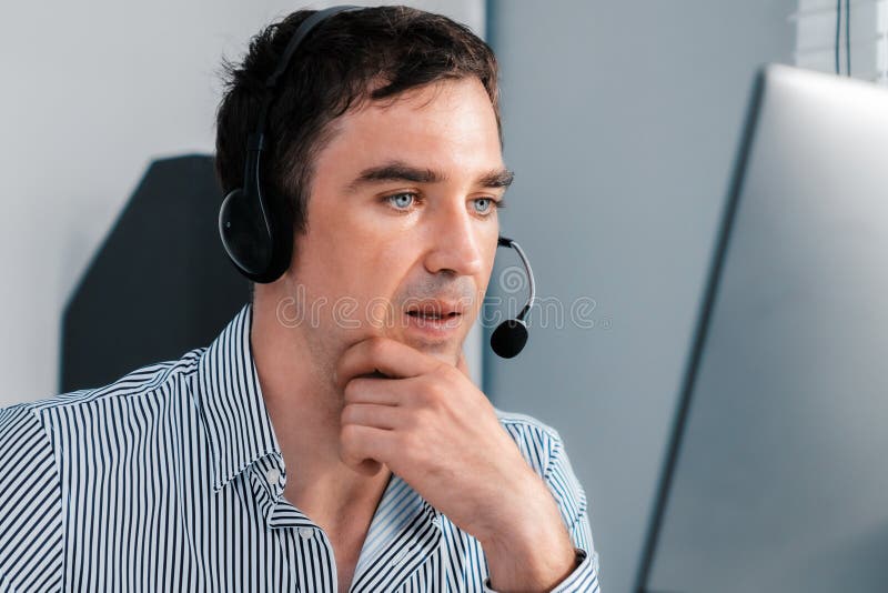 Competent Male Operator Working with Customers in the Office. Stock ...