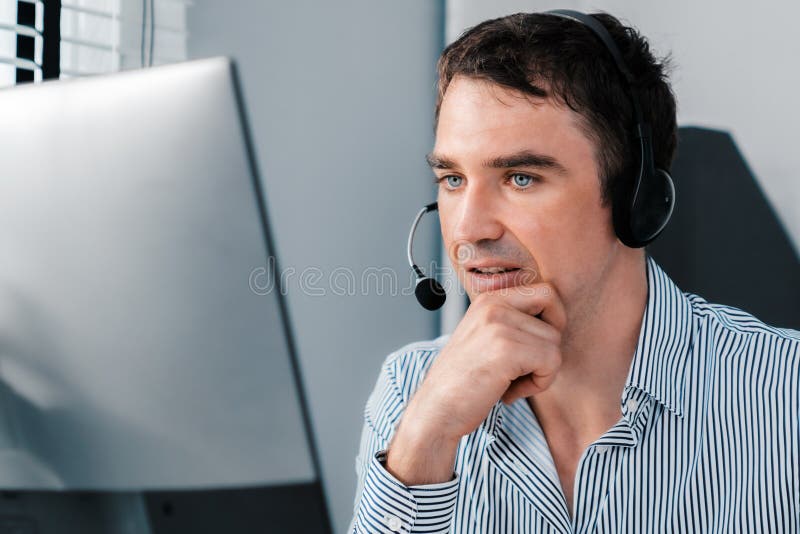 Competent Male Operator Working with Customers in the Office. Stock ...