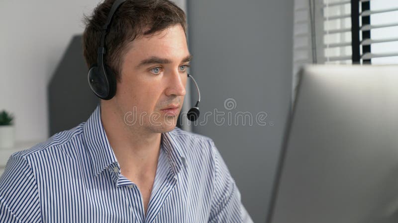 Competent Male Operator Working with Customers in the Office. Stock ...
