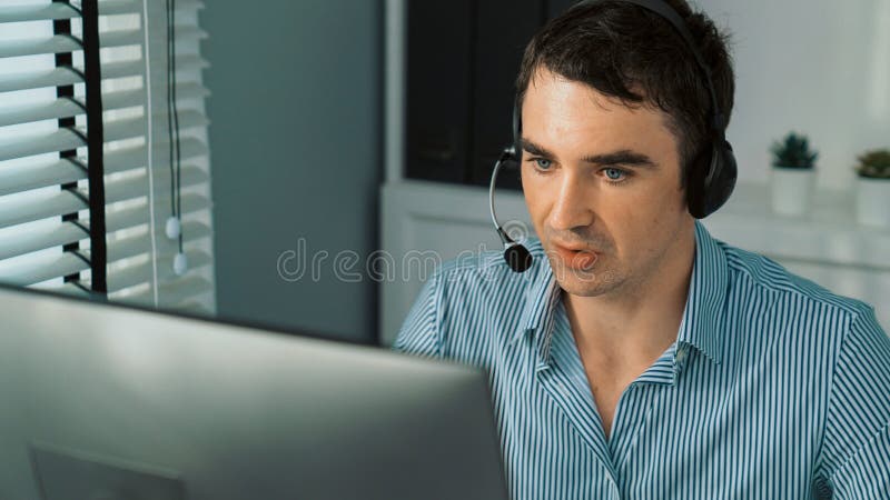 Competent Male Operator Working with Customers in the Office. Stock ...