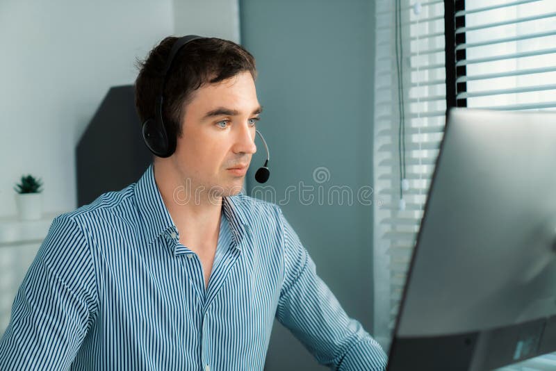 Competent Male Operator Working with Customers in the Office. Stock ...