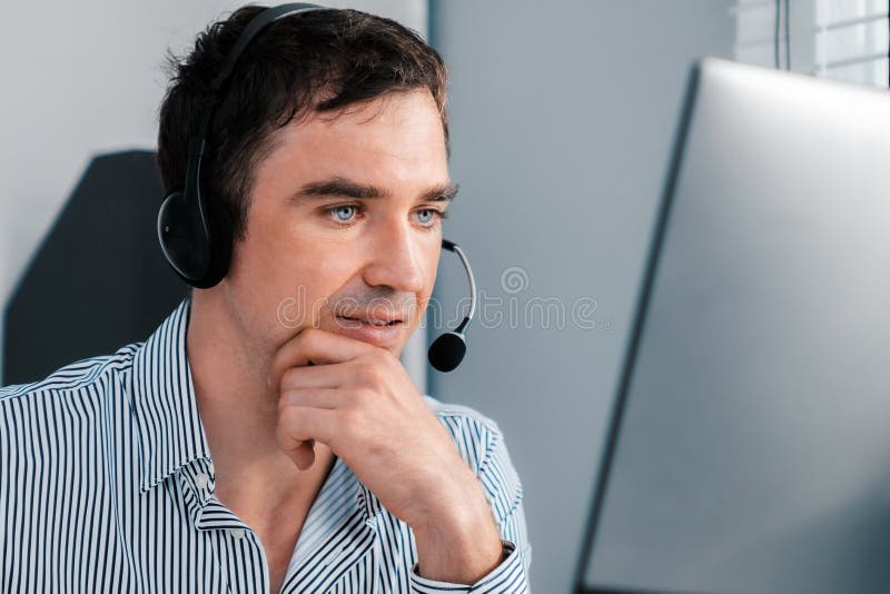 Competent Male Operator Working with Customers in the Office. Stock ...