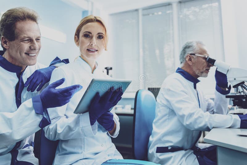 Competent Practitioner Working with Microscope Stock Image - Image of ...