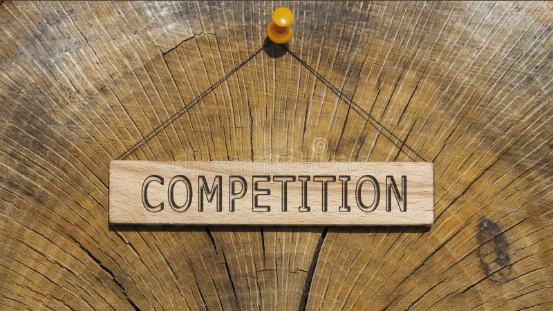 Competition. Written on Wooden Hanging Frame. Background Wood Cut Log ...
