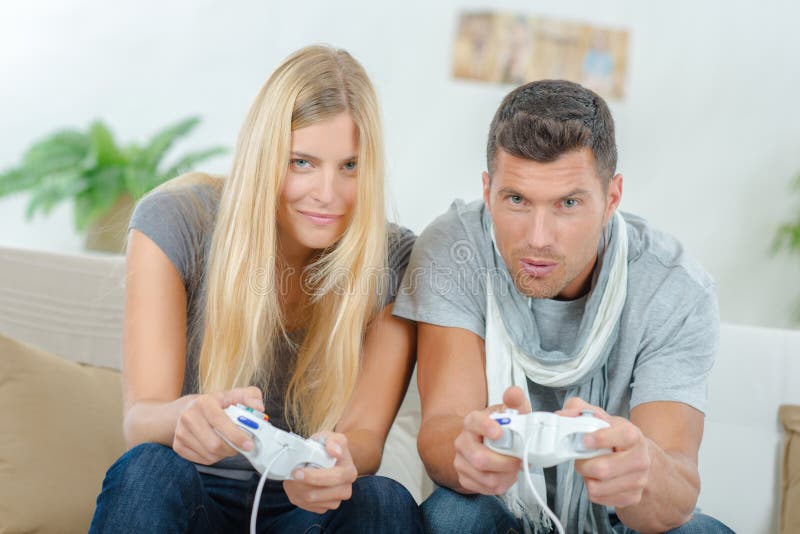 Competitive Couple Playing Video Games Stock Photo - Image of years ...