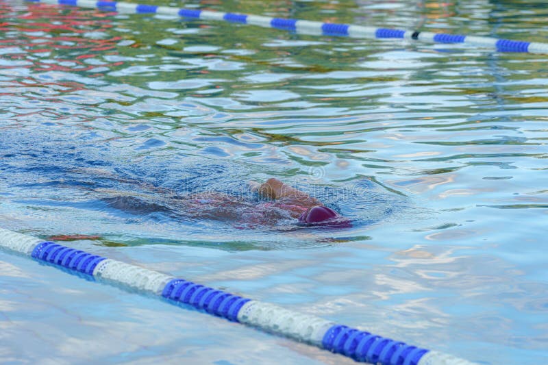 A Competitive Swimmer Swims in a Pool during Training Stock Image ...