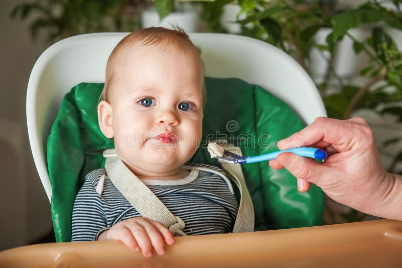 Complementary Feeding of Child, Baby Food. the Infant is Spoon-fed ...