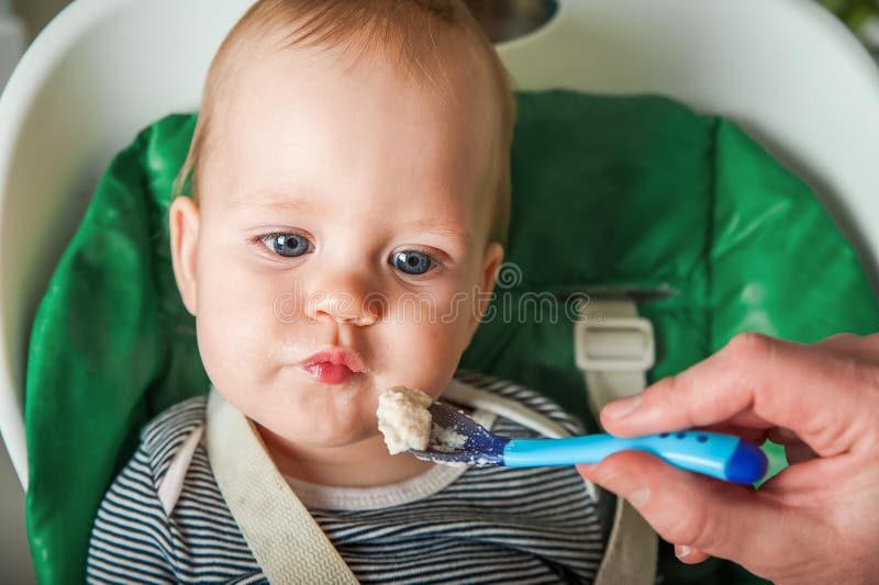 Complementary Feeding of Child, Baby Food. the Infant is Spoon-fed ...