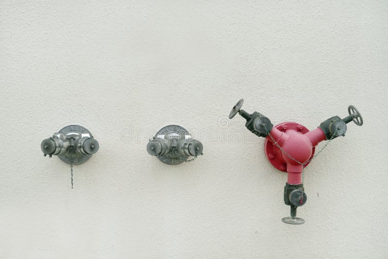 A Complete Fire Hydrant on the Wall Stock Image - Image of dual, outlet ...