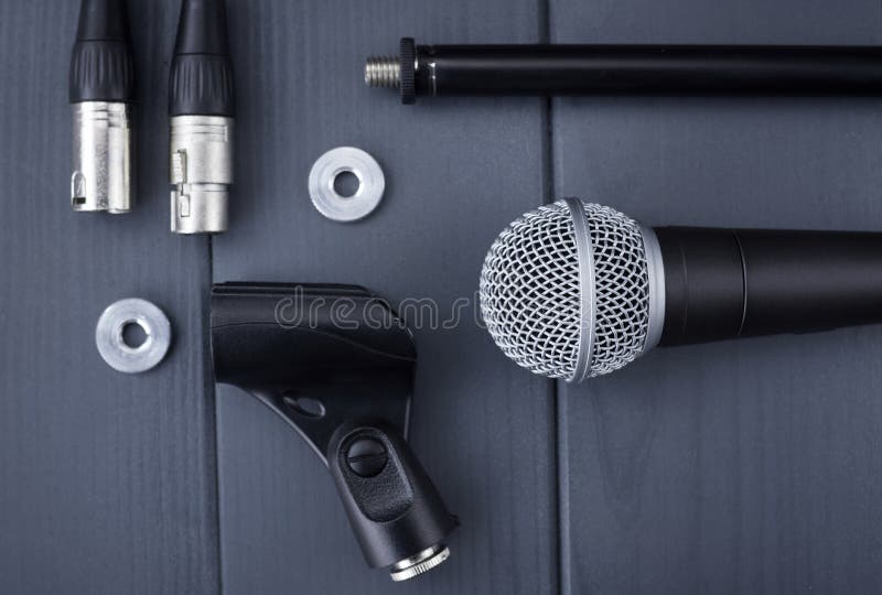 Microphone with Stand, Lock Washers and Xlr Connectors on Wooden Table ...