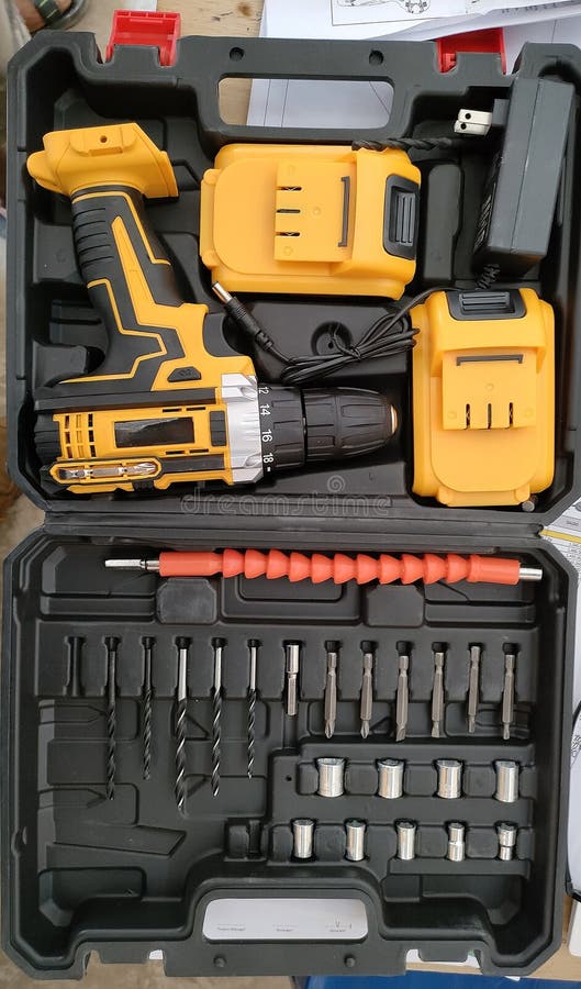 A Complete Set of Yellow Cordless Electric Drills in a Black Box ...