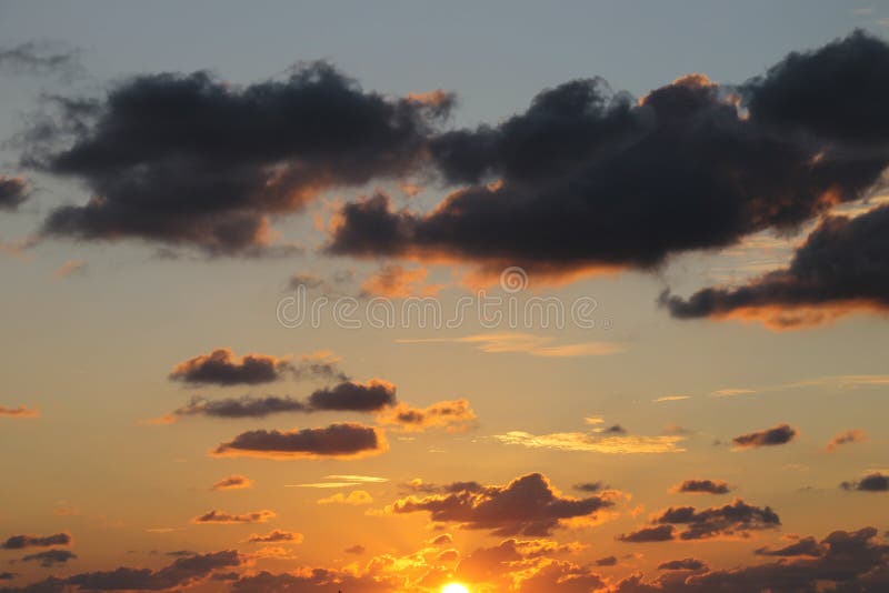 Almost Complete Sunset in Grey and Blue Sky Stock Photo - Image of ...