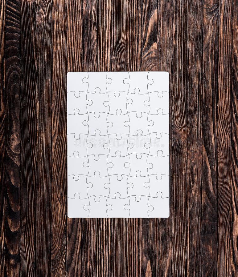 White Completed Puzzle on White Wooden Table Stock Image - Image of ...