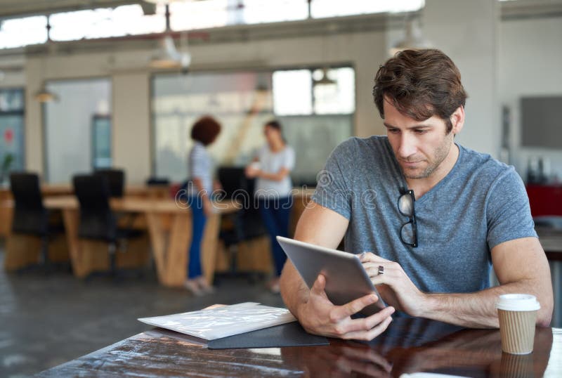 Completely Focused on His Task. Shot of a Young Man Working on a ...