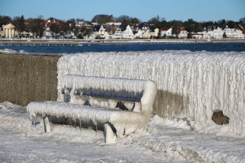 A Completely Frozen Bench that Stands on the Promenade and is ...