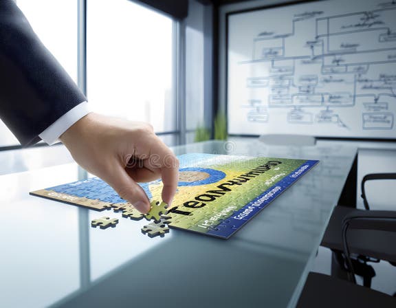 Completing a Jigsaw Puzzle of Team Success Symbolizes Collaboration and ...