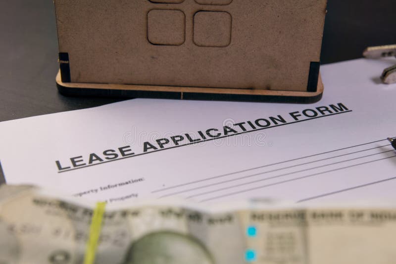 Completing a Lease Application Form on a Desk Stock Image - Image of ...