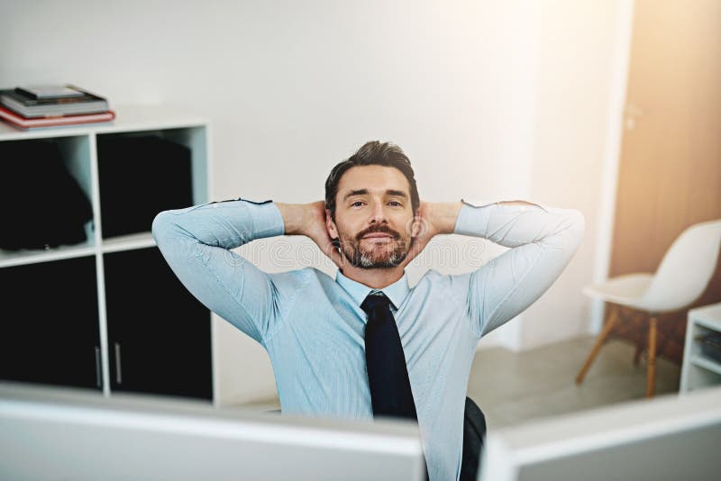 Completing Work Tasks Like a Boss. a Mature Businessman Relaxing at His ... Completing Work Tasks Like a Boss. a Mature Businessman Relaxing at His ...