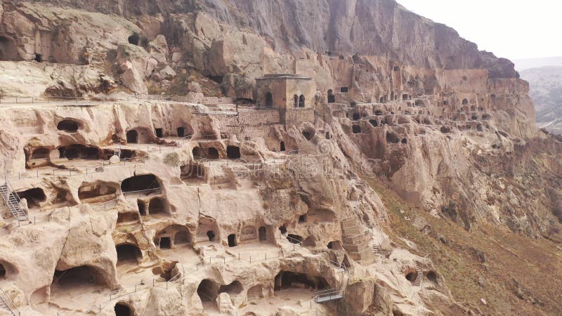 Complex of Cave Monastery Structures Carved into Mountain in Historic ...