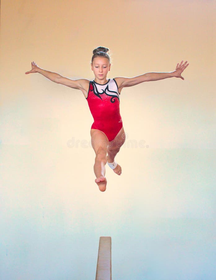 Complex Elements of Gymnastics Girls Training in the Gym Stock Image ...
