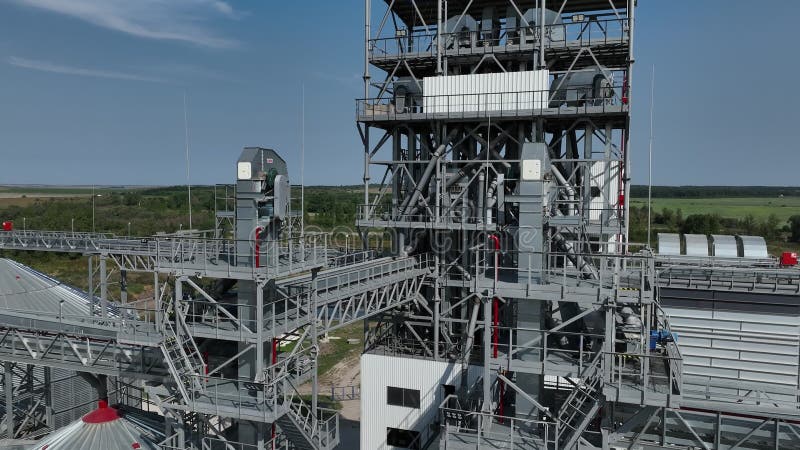 Complex Industrial Facility with Storage Silos and Piping System. a ...