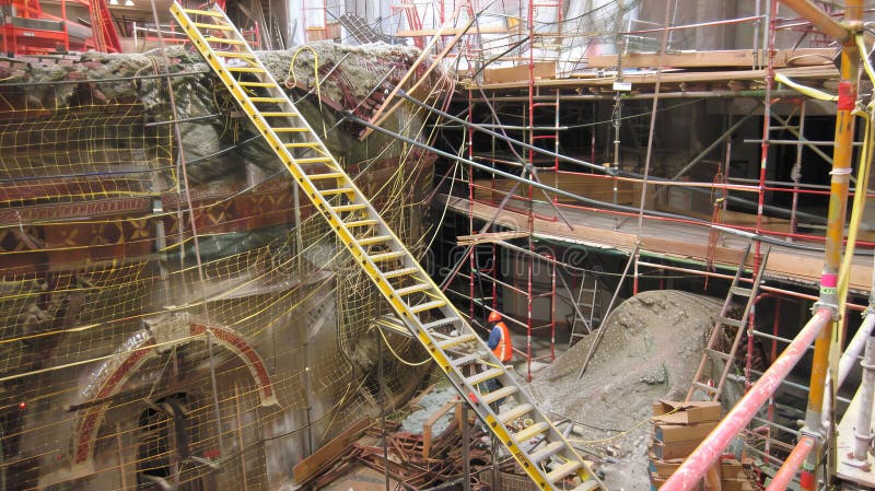 Complex Stage Construction with Scaffolding and Workers. Safety Ladder ...