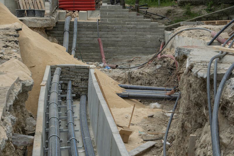 Complex Underground Construction Site with Trenches, Pipes, Conduits ...