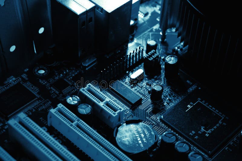 Components on PC Circuit Board. Chip, Fan, Capacitor and Connectors on ...