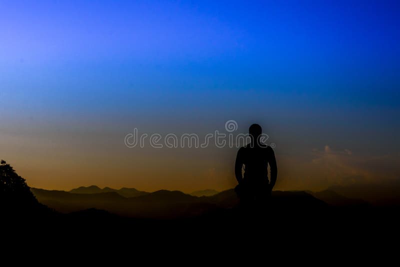 Composed Silhouette of a Man Watching Sunset on Hillside Editorial ...