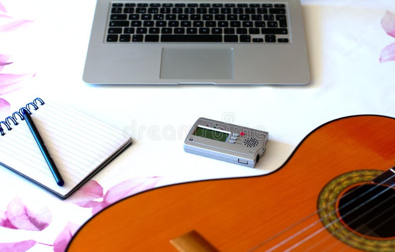 Composer`s Work Table. Top View of Guitar, Notepad, Computer and Tuner ...