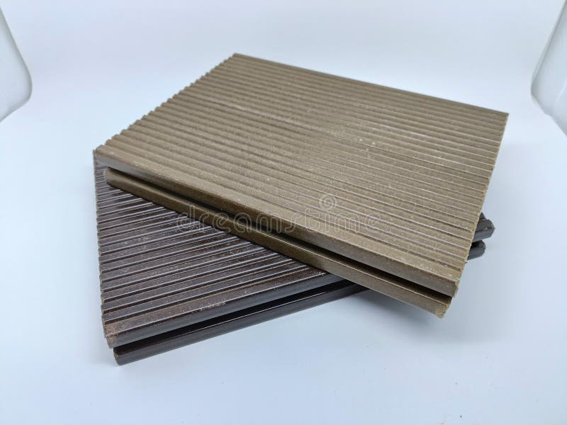 Stack of Composite Decking Boards with Grooved Surface in Various Brown ...