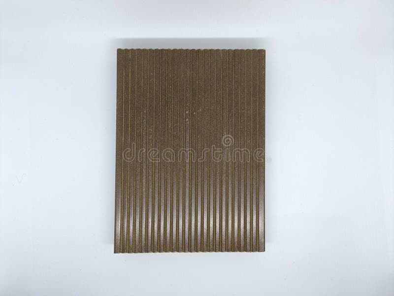 Stack of Composite Decking Boards with Grooved Surface in Various Brown ...