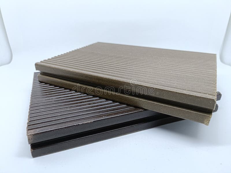 Stack of Composite Decking Boards with Grooved Surface in Various Brown ...
