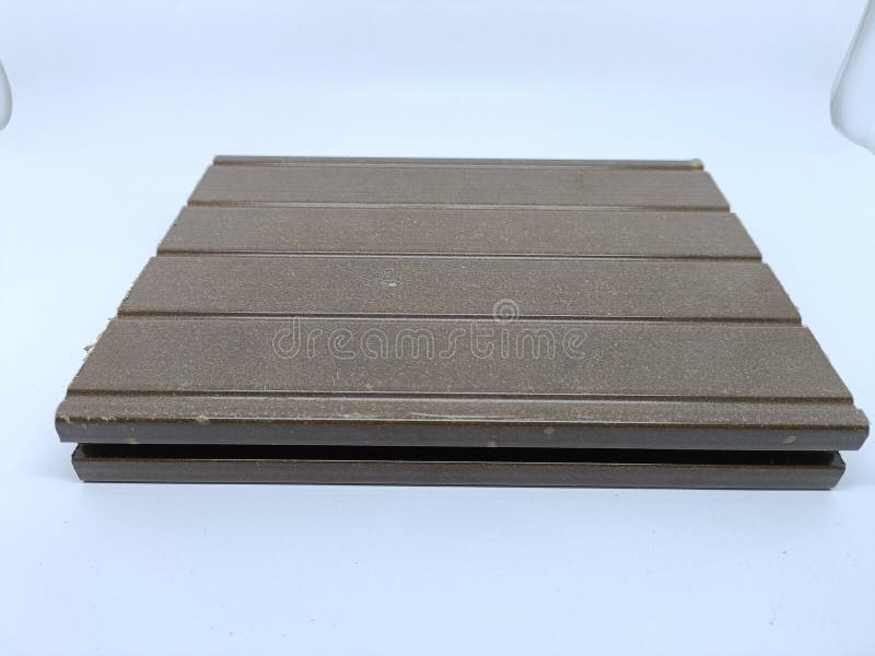 Stack of Composite Decking Boards with Grooved Surface in Various Brown ...
