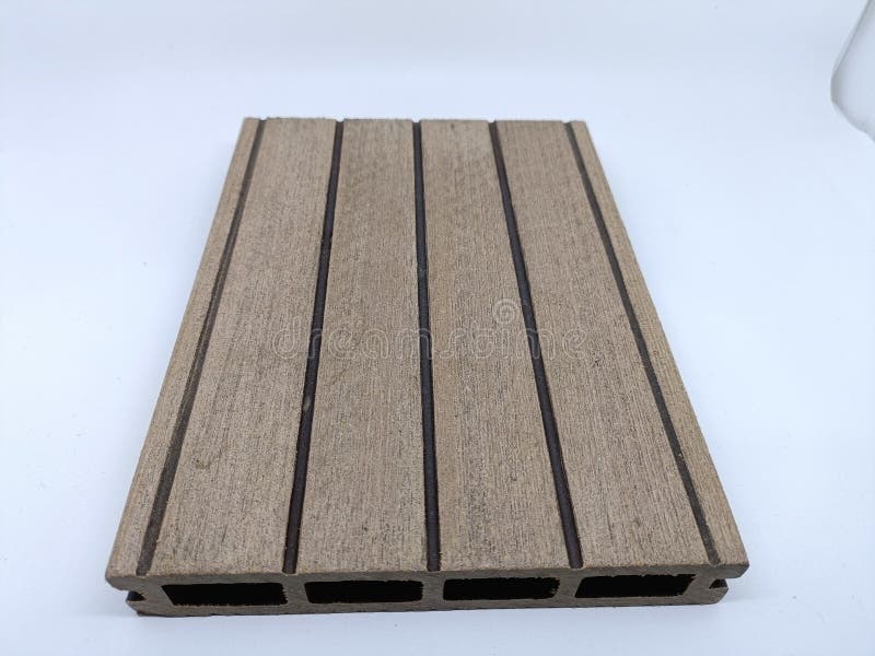 Stack of Composite Decking Boards with Grooved Surface in Various Brown ...