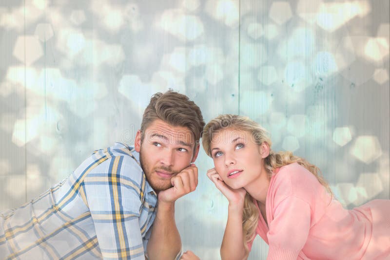 Composite Image of Attractive Young Couple Lying and Thinking Stock ...