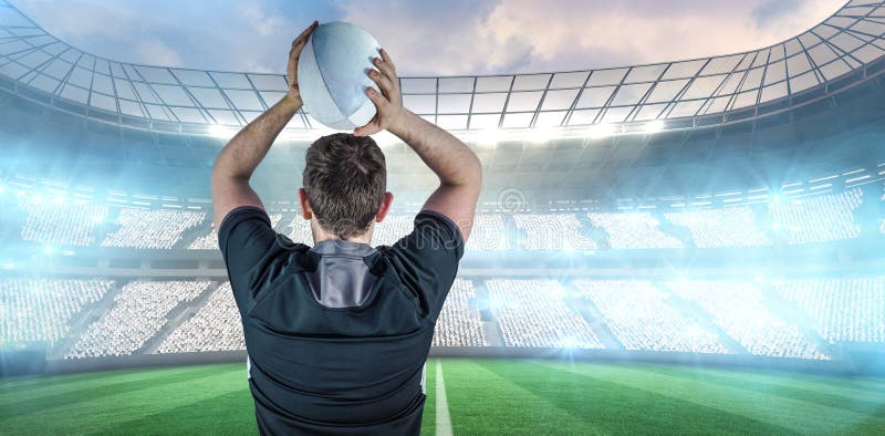 Composite Image of Back Turned Rugby Player Throwing a Ball Stock Image ...