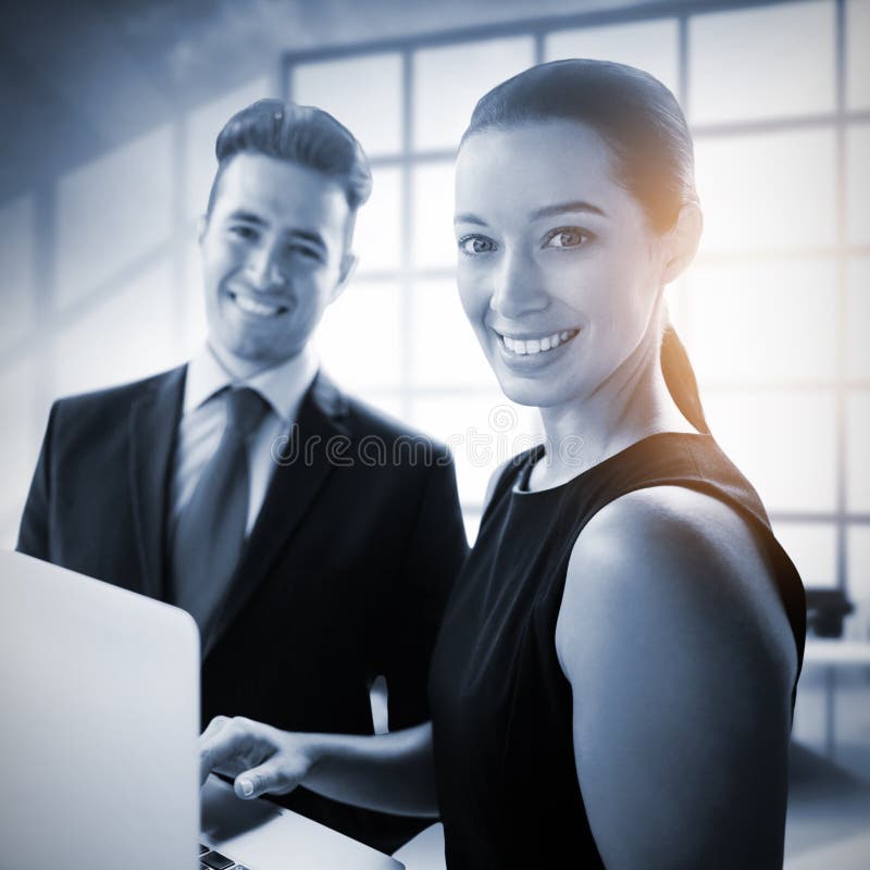 Composite Image of Business People Standing with a Laptop Stock Photo ...