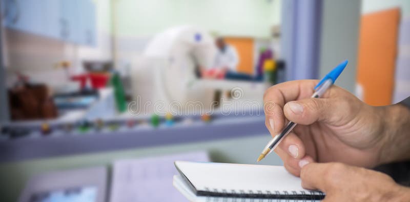 Composite Image of Close Up of Man Writing in Notepad Stock Image ...