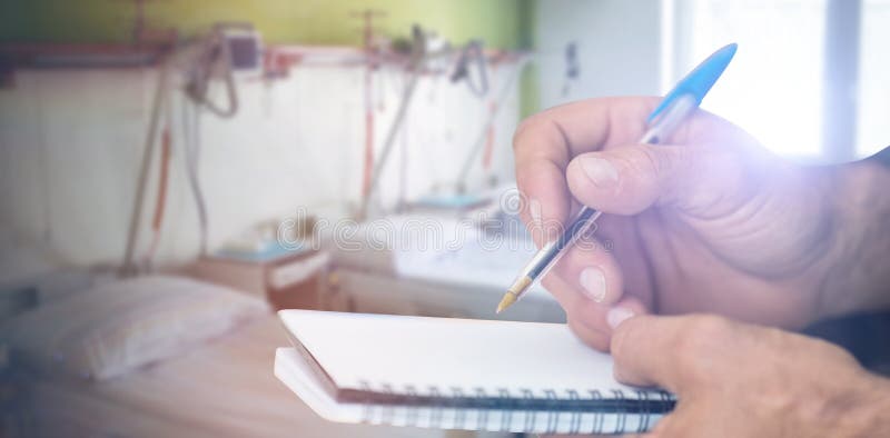 Composite Image of Close Up of Man Writing in Notepad Stock Photo ...