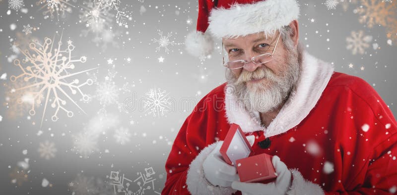 Composite Image of Close-up of Santa Claus Opening Christmas Gift Stock ...