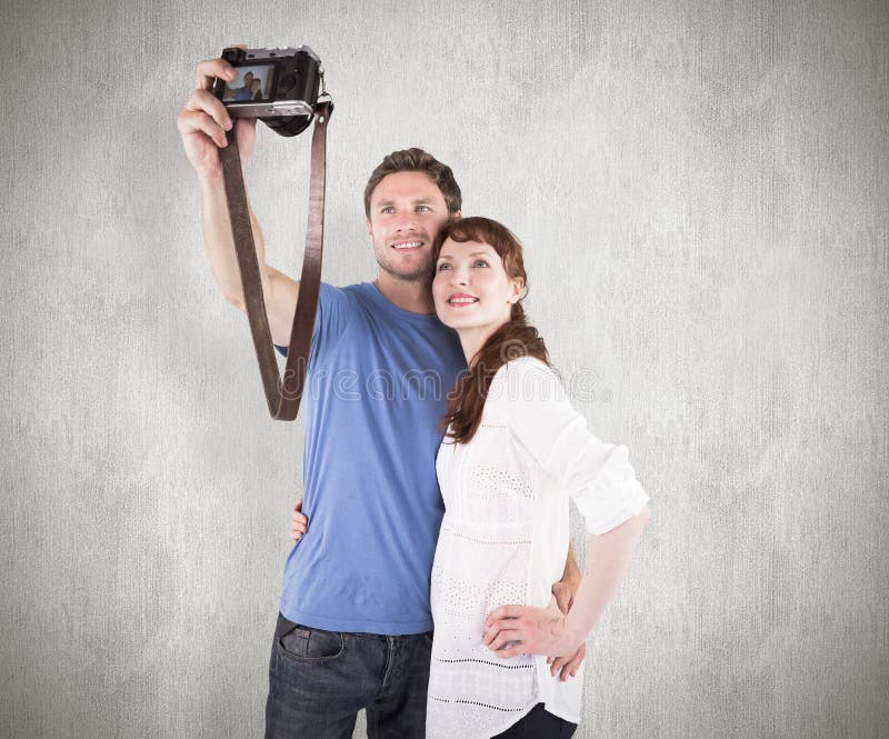 Composite Image of Couple Using Camera for Picture Stock Photo - Image ...