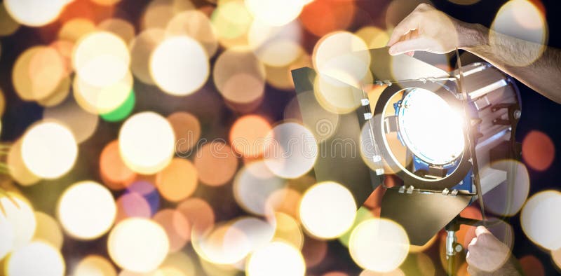 Composite Image of Cropped Hands Holding Focus Light Stock Photo ...