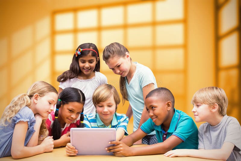 Composite Image of Cute Pupils Using Tablet Computer in Library Stock ...