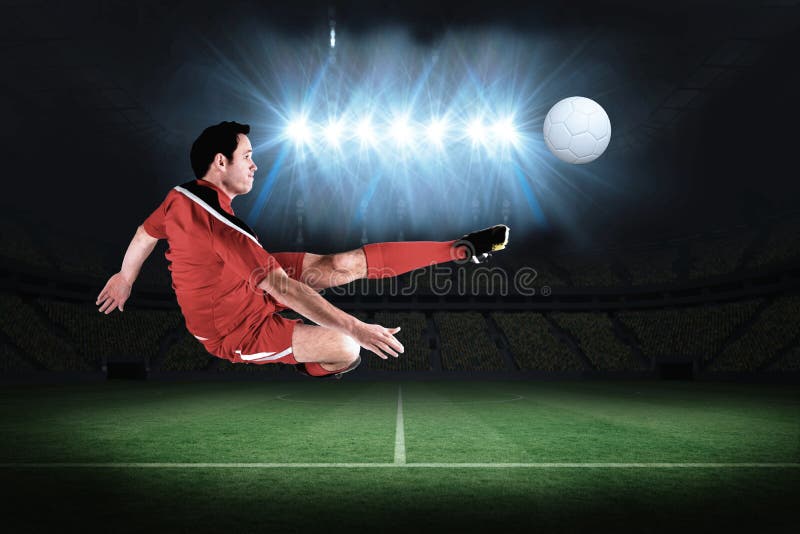 Composite Image of Football Player in Red Kicking Stock Photo - Image ...
